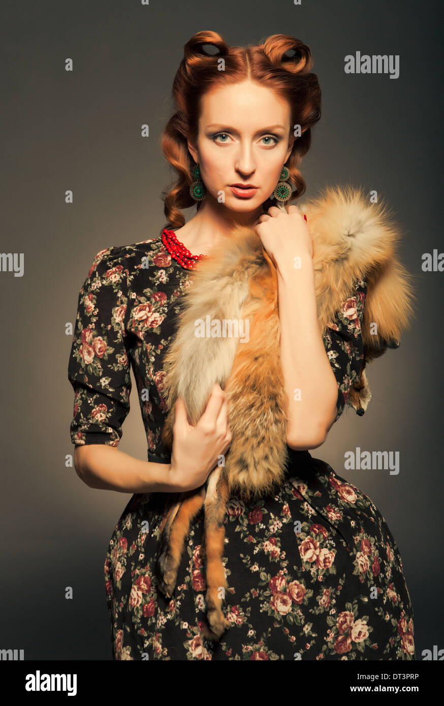 Girl in retro style posing with fur things Stock Photo - Alamy
