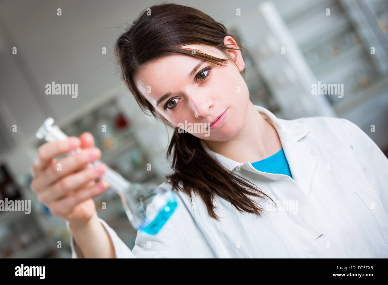 Portrait of a female researcher/chemistry student carrying out research ...