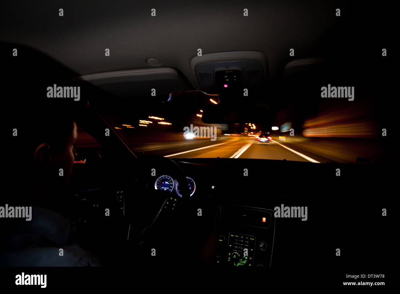 Driving a car at night Stock Photo - Alamy