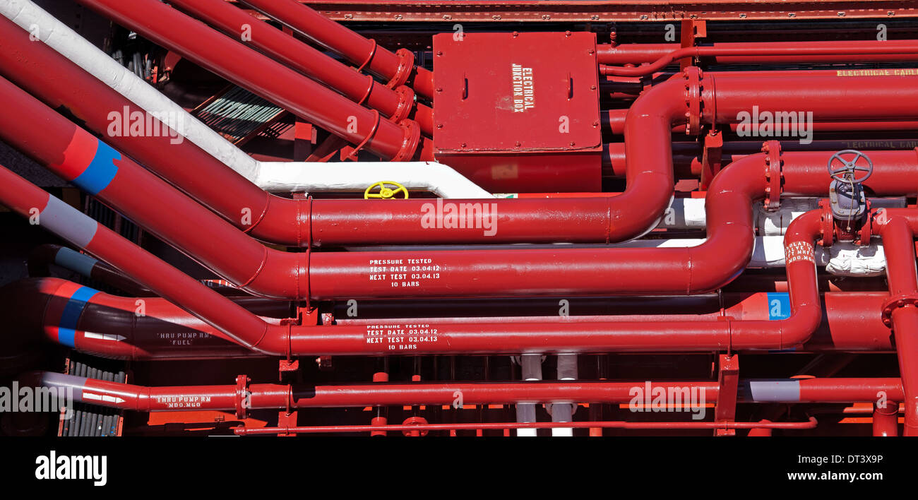 Red-painted pipework detail aboard a bunkering vessel in Gibraltar ...