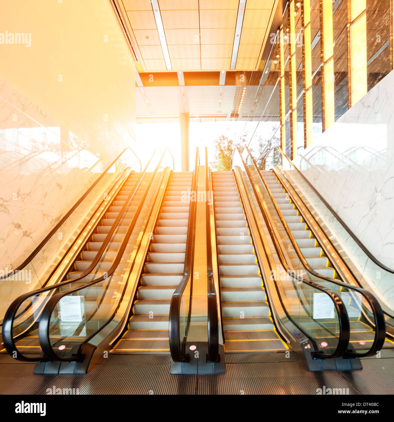 Escalators in an office building Stock Photo - Alamy