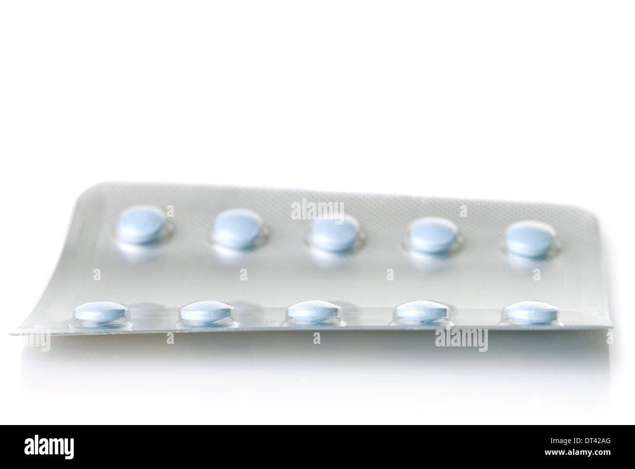 pack of blue tablets isolated on white Stock Photo - Alamy