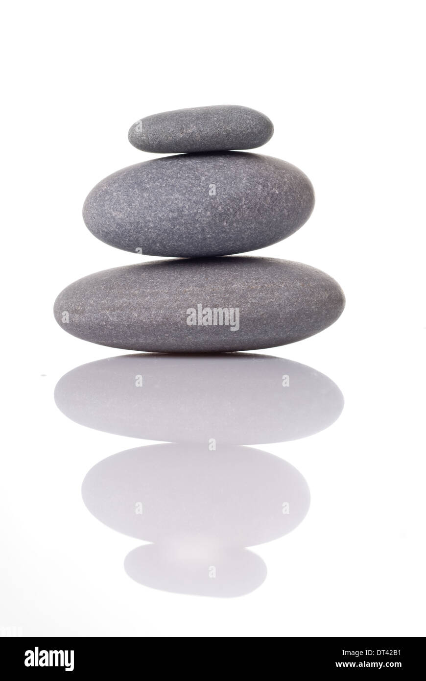 Spa stones with reflection isolated on white Stock Photo - Alamy