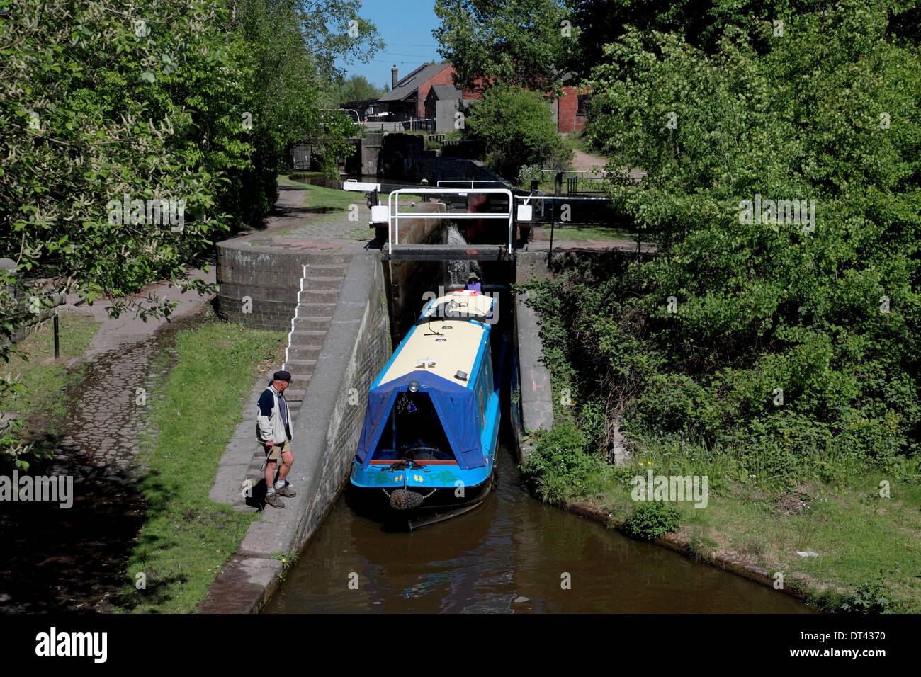 A narrowboat leaving lock 39 of the Stoke flight of locks on the Trent ...