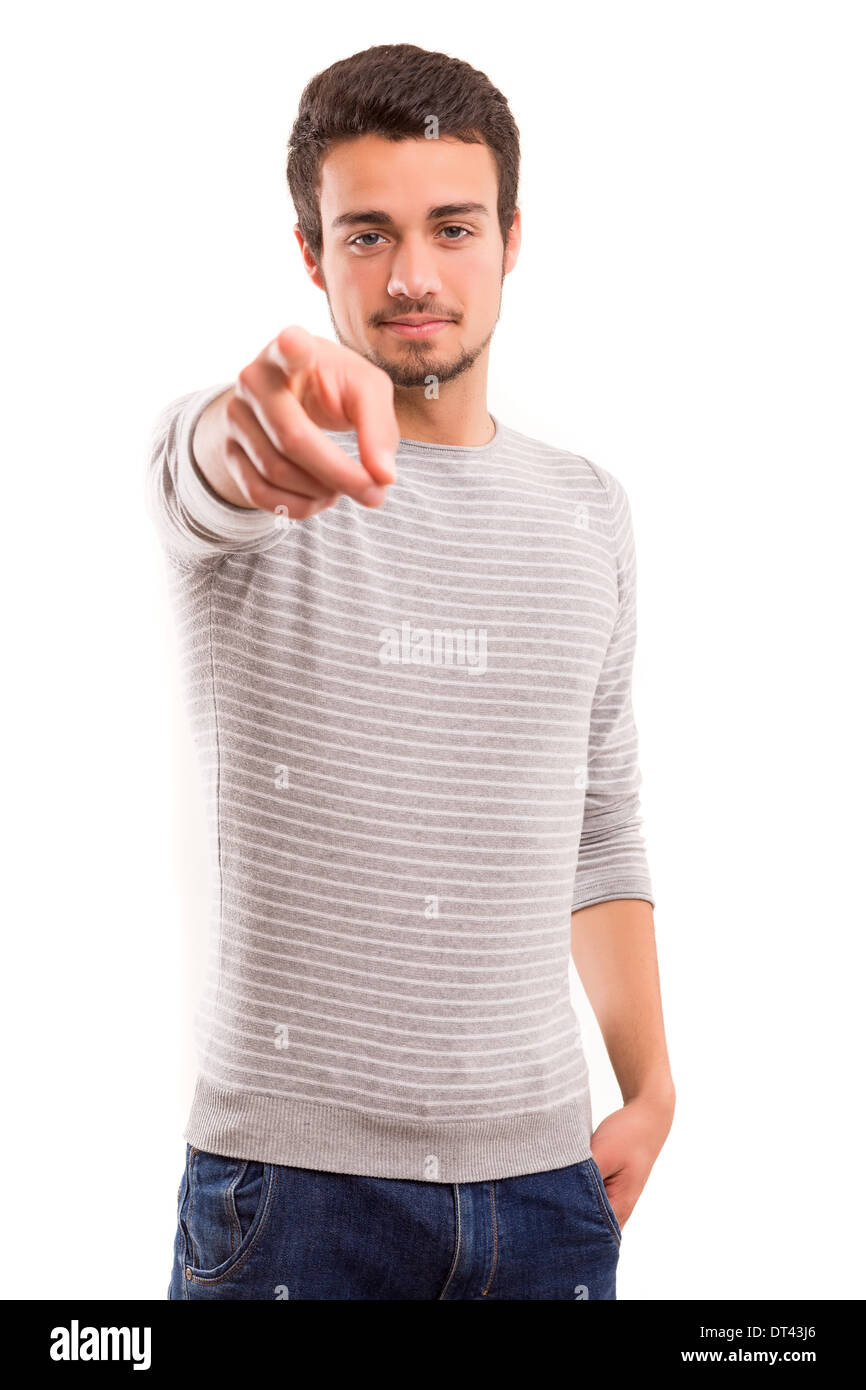 Handsome young man pointing at you, isolated over white background ...