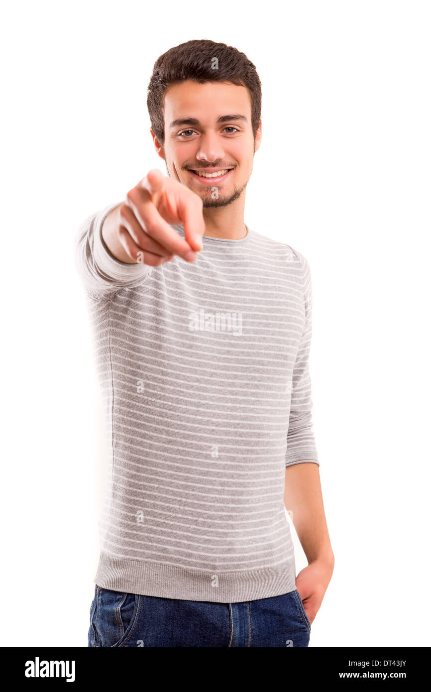 Handsome young man pointing at you, isolated over white background ...