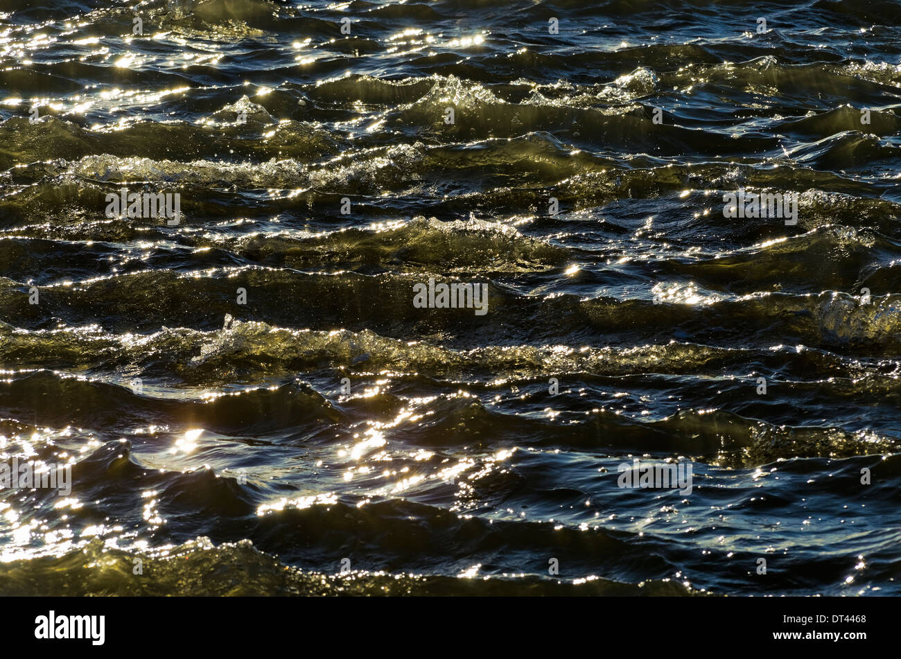 back-light breaking waves choppy water Stock Photo - Alamy