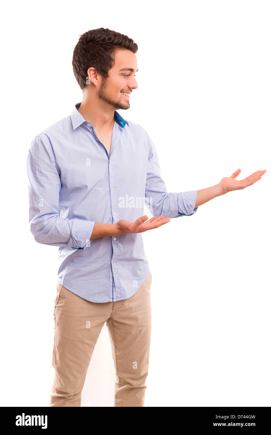 Young man presenting your product, isolated over a white background ...