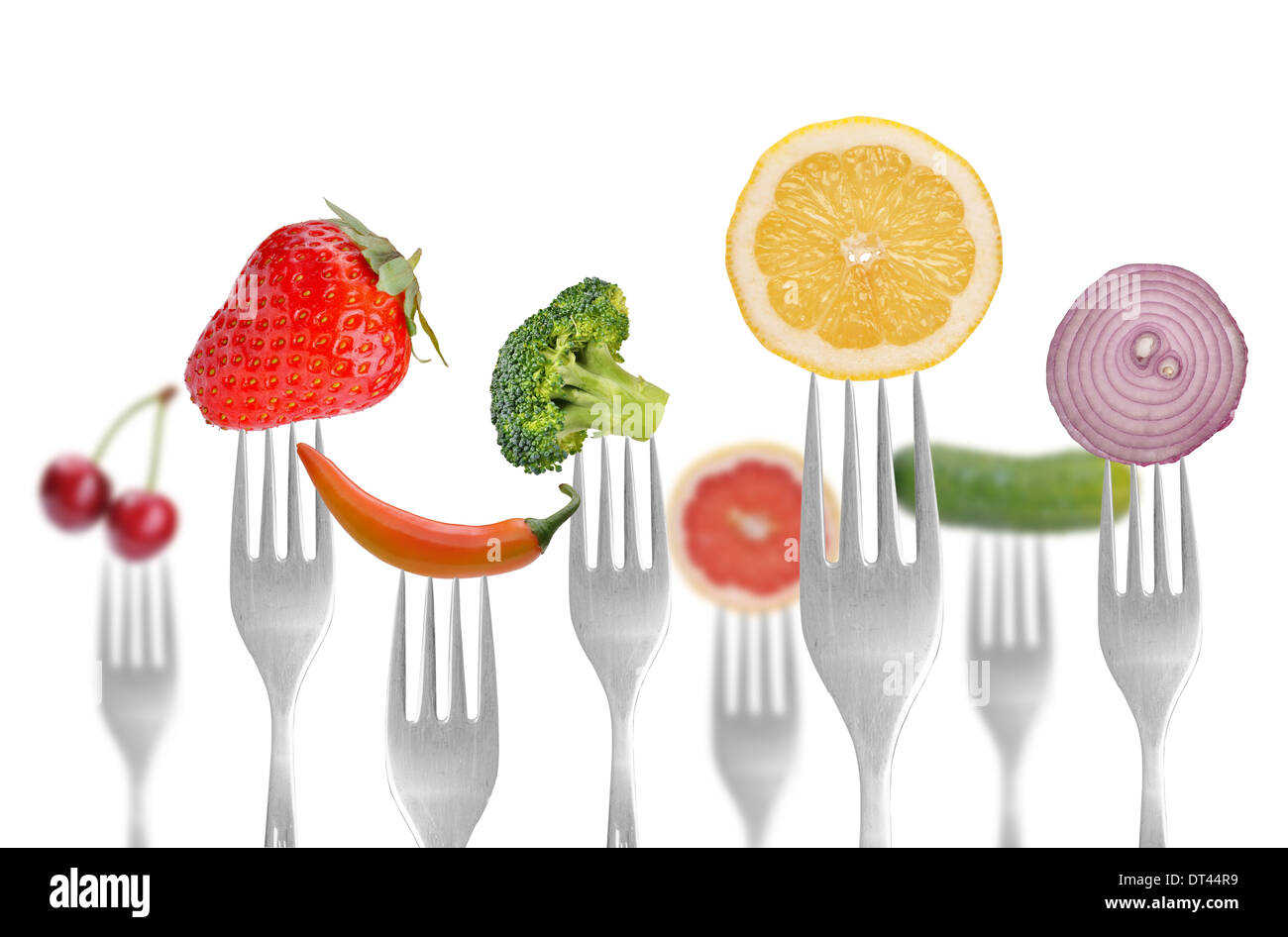 vegetables and fruits on the collection of forks, diet concept Stock ...