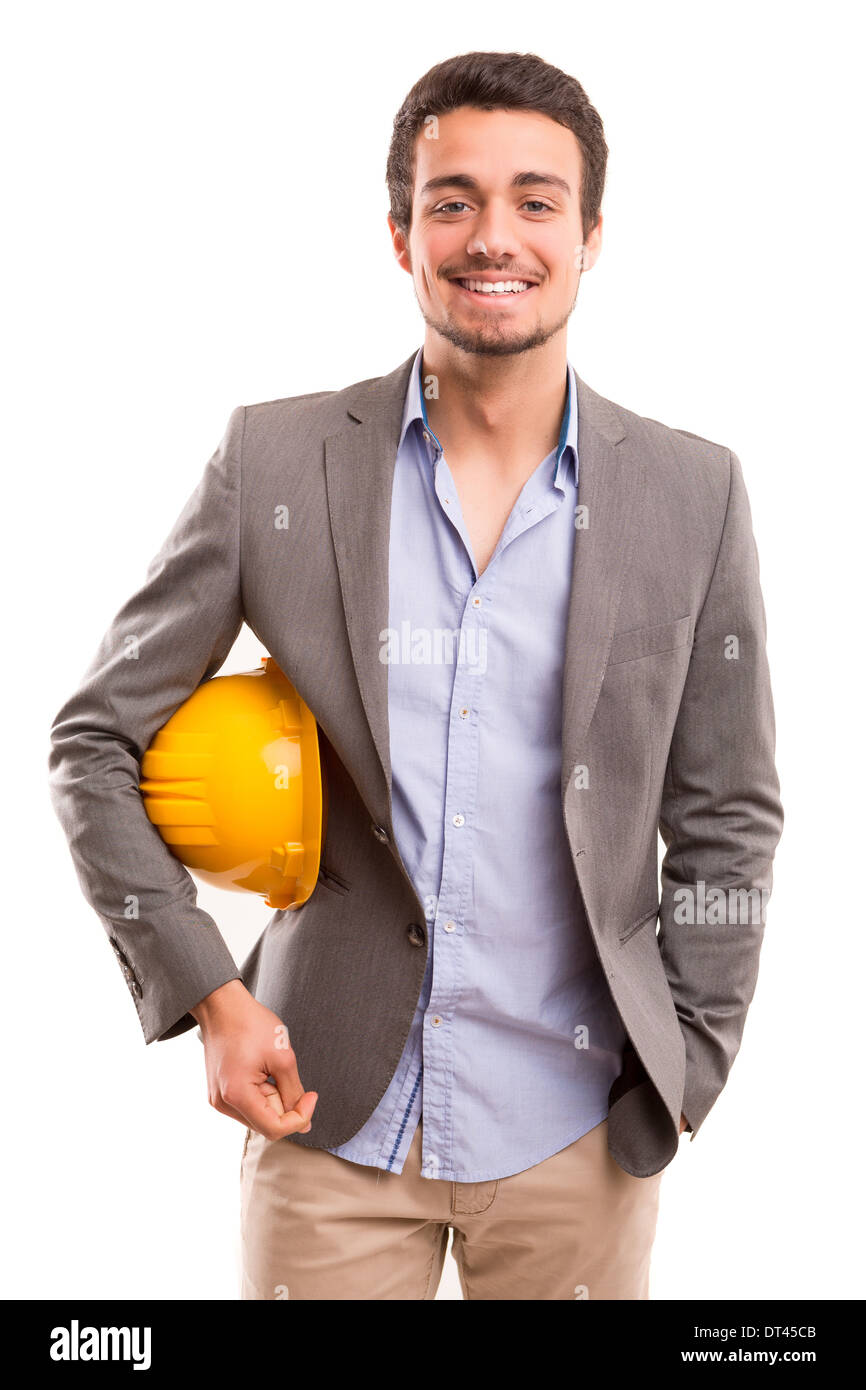 Handsome young engineer posing isolated over white background Stock ...
