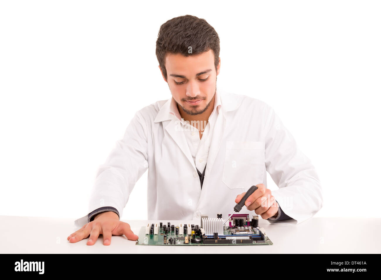 A computer engineer or technician, working on a computer motherboard ...