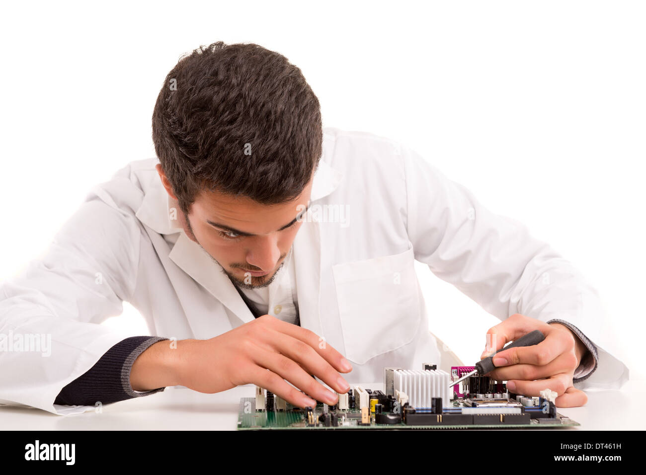 A computer engineer or technician, working on a computer motherboard ...