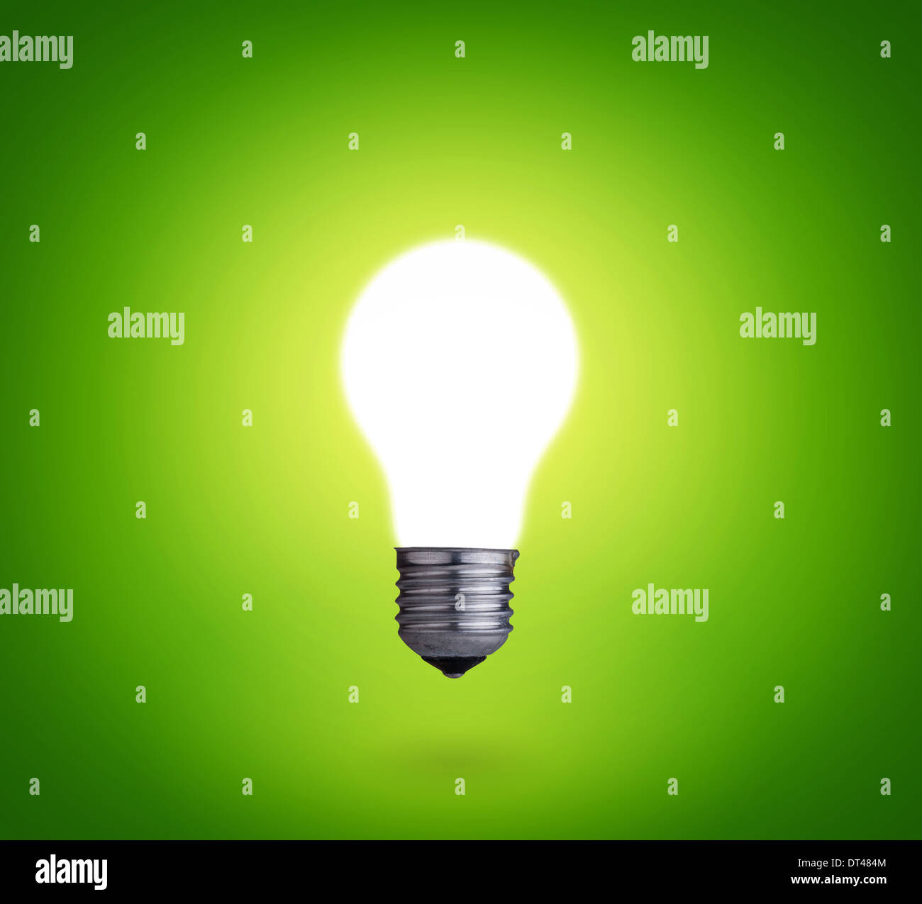 idea concept whit one glowing light bulb on green background Stock ...