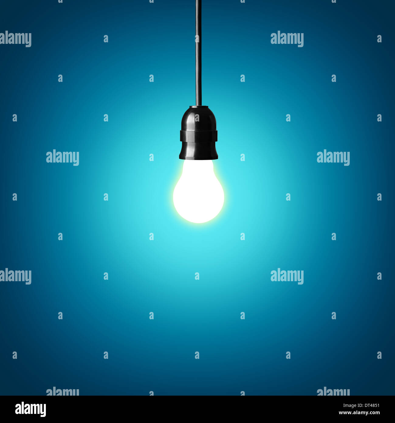 Bulb on blue background.Idea concept Stock Photo - Alamy