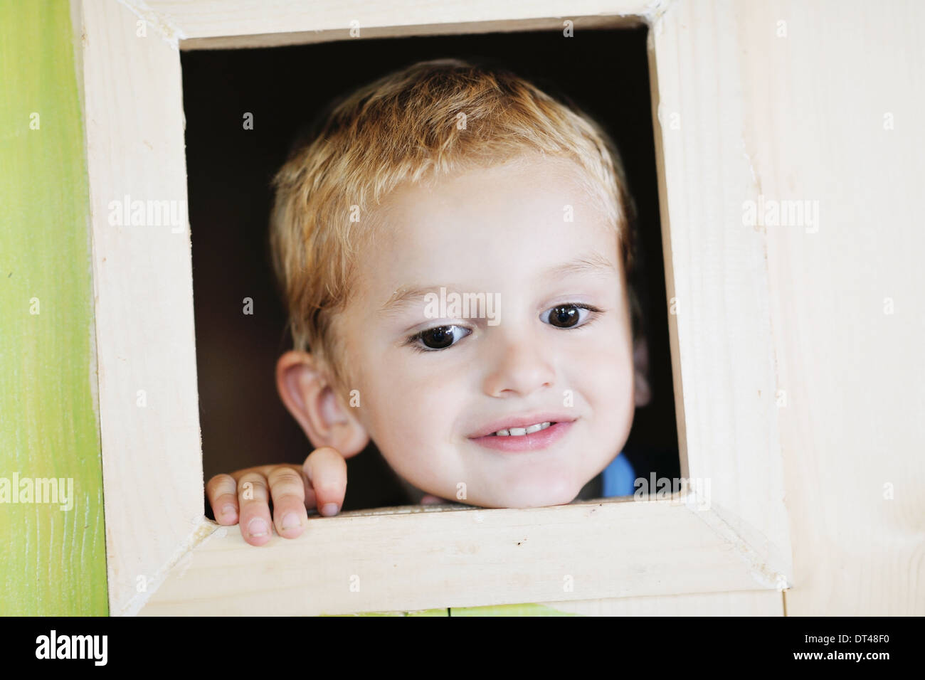 happy child in a window Stock Photo - Alamy