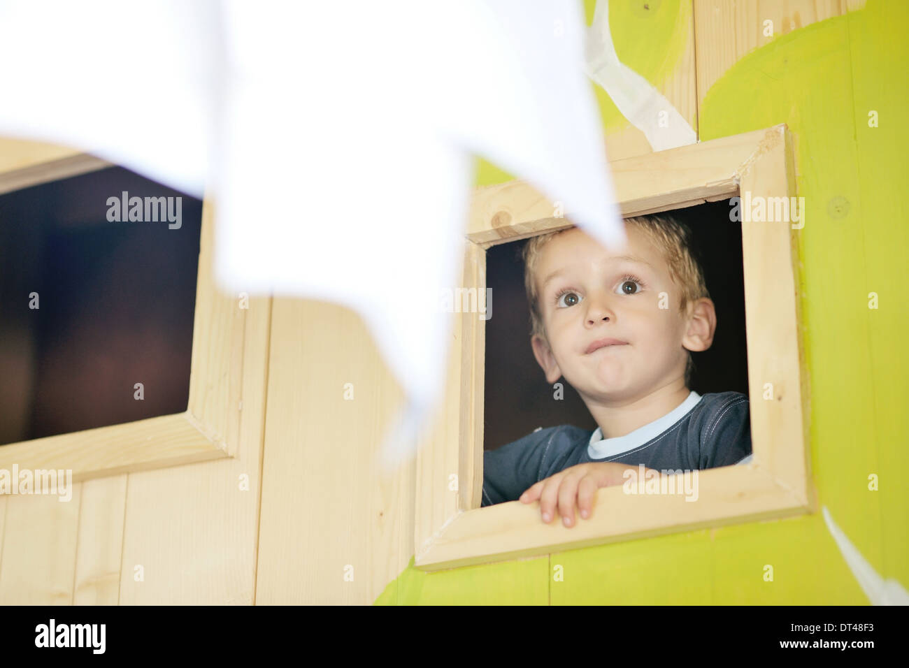 happy child in a window Stock Photo - Alamy