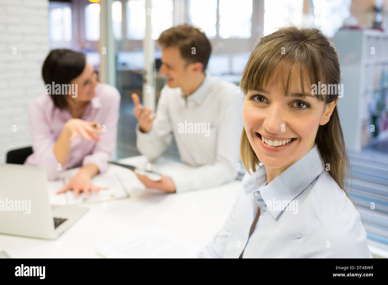 Business woman reunion office desk colleagues smil Stock Photo - Alamy