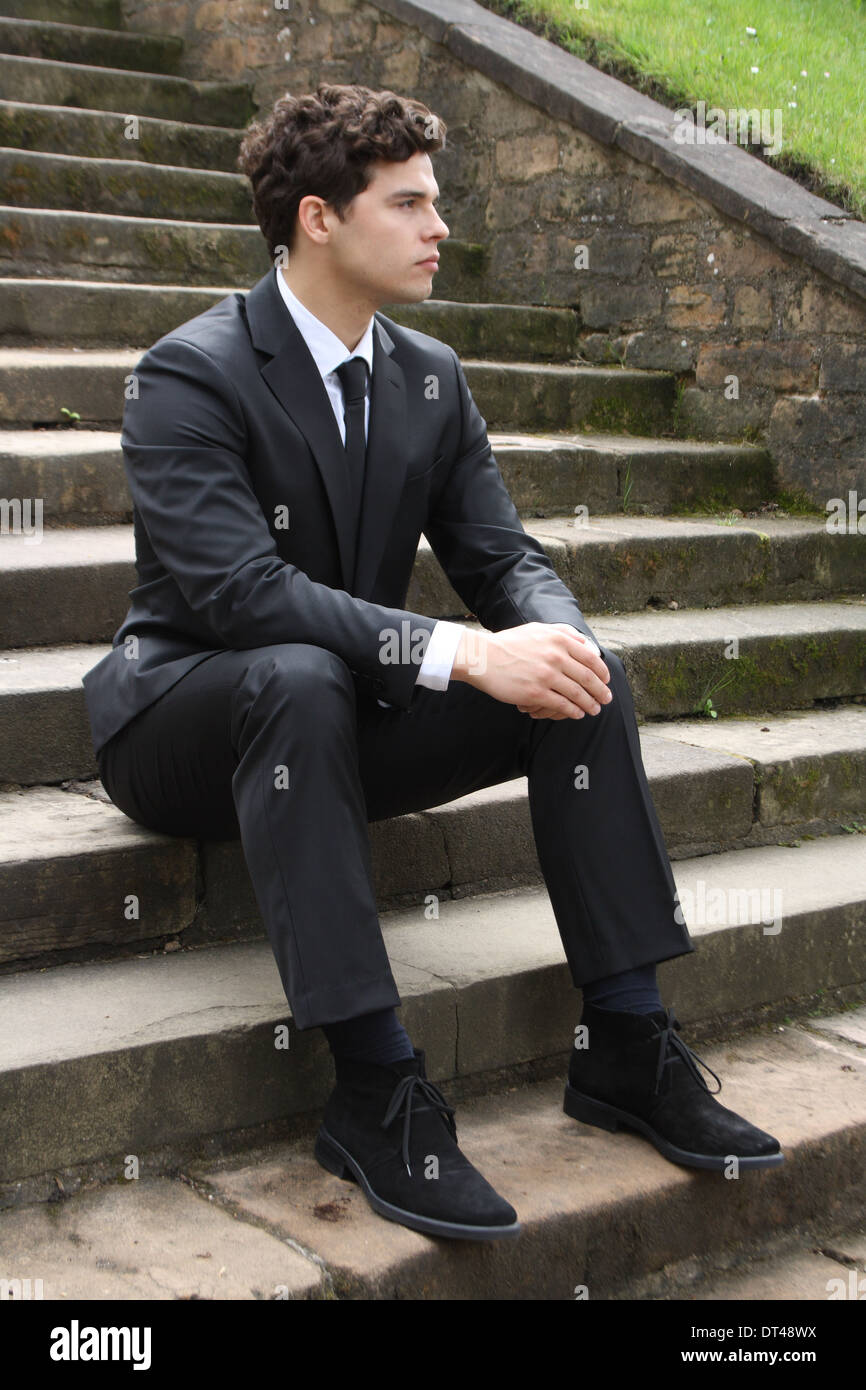 Male model sitting wall hi-res stock photography and images - Alamy
