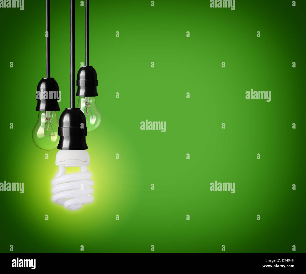 Light bulbs on green background Stock Photo - Alamy