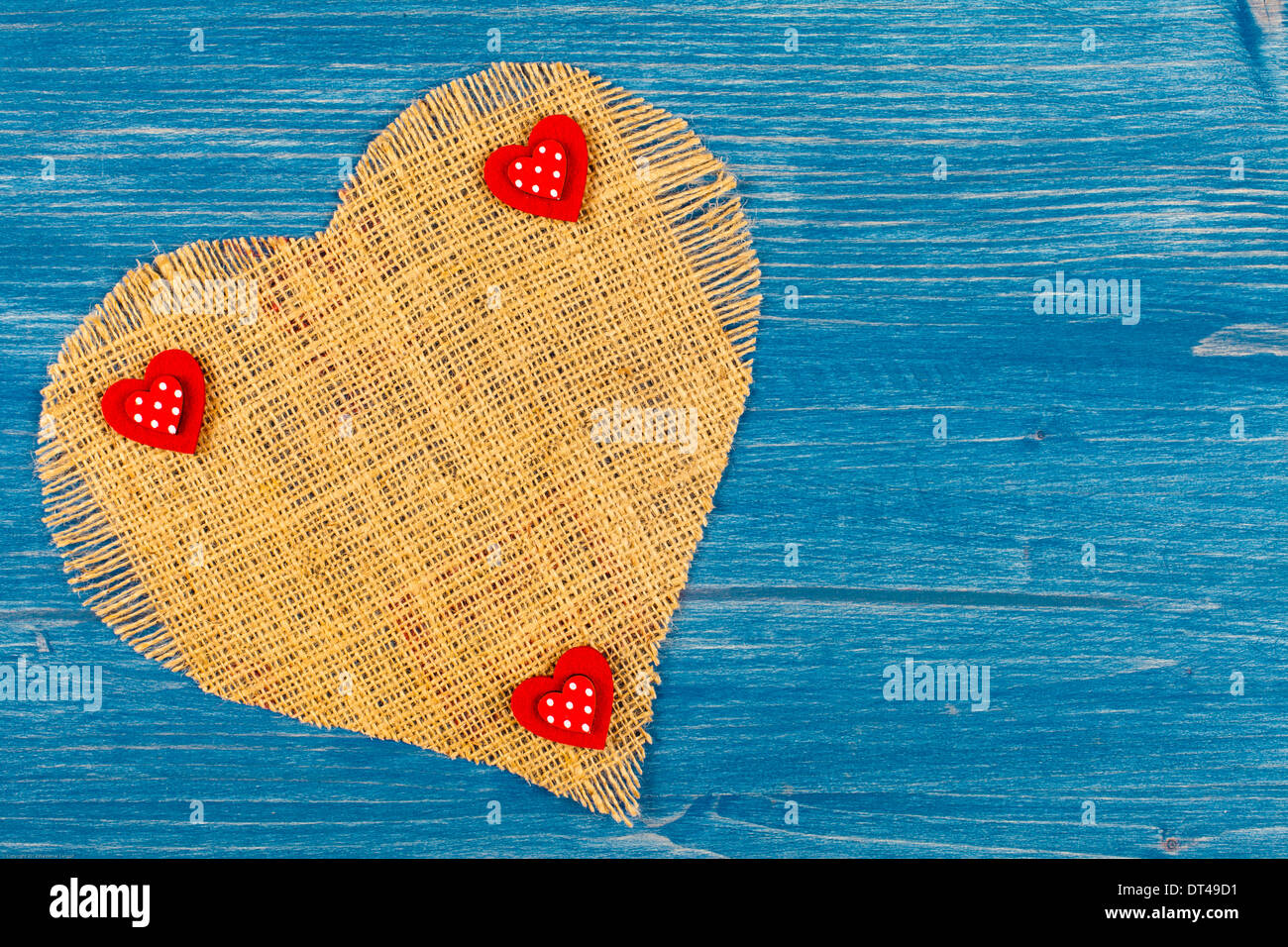 Heart made of linen on a blue background with 3 little hearts Stock ...
