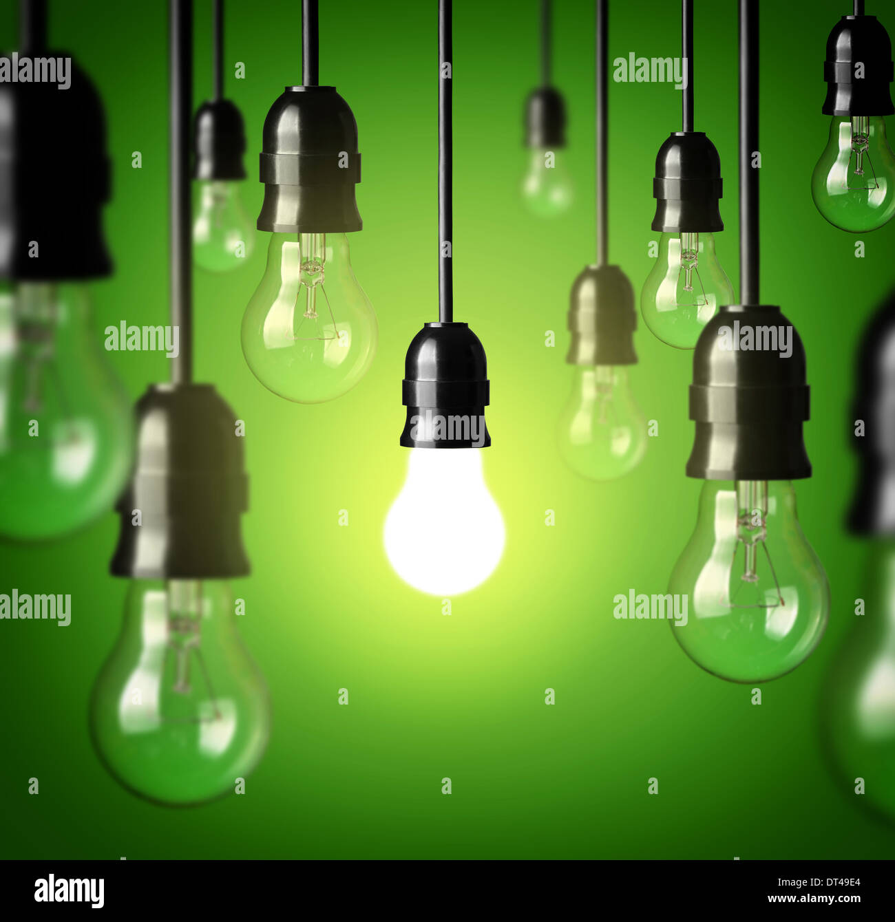 light bulbs on a green background.Idea concept Stock Photo - Alamy