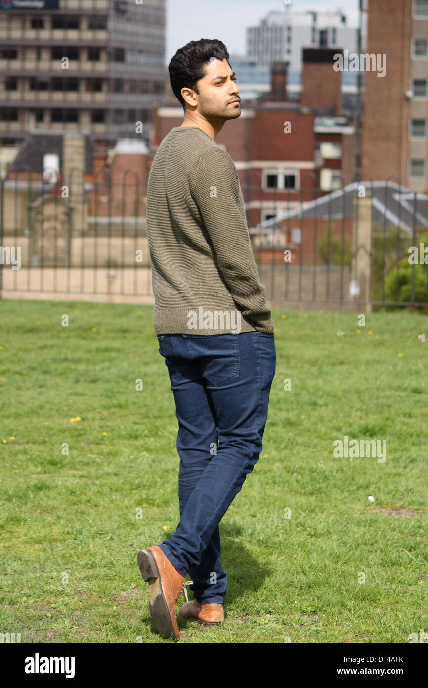 A male model looking across with his back turned Stock Photo - Alamy