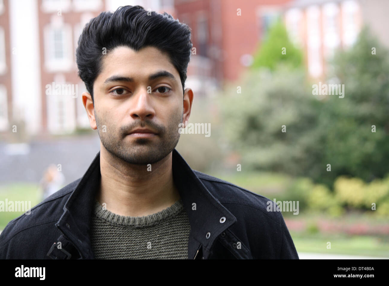 A male model looking straight into the camera Stock Photo - Alamy