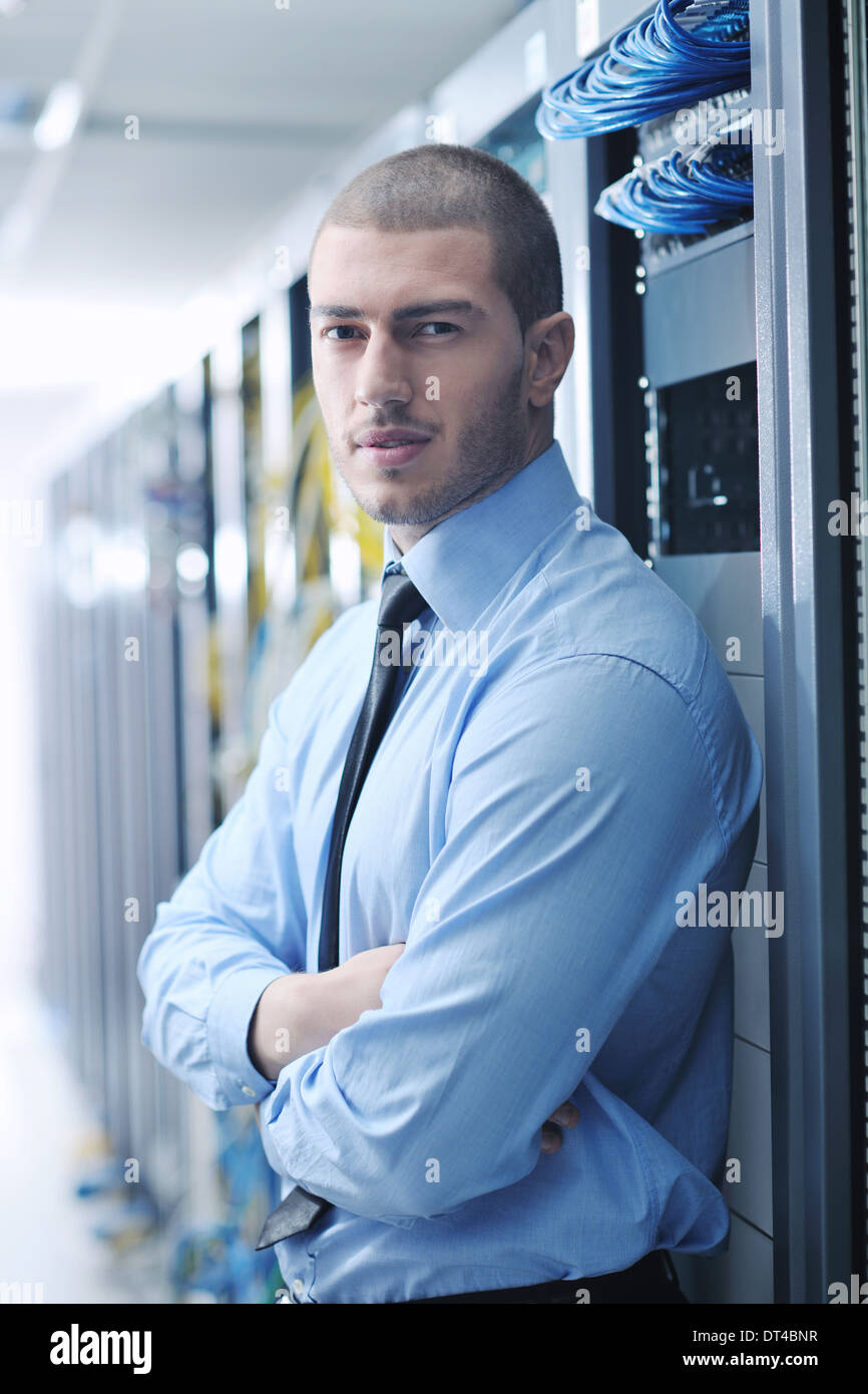 young it engeneer in datacenter server room Stock Photo - Alamy