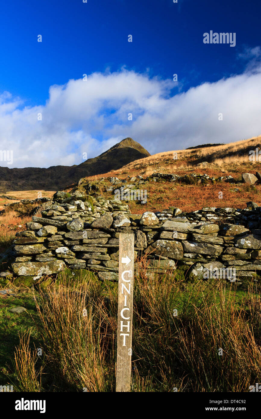 A signpost indicating the route up Cnicht in Snowdonia National Park ...