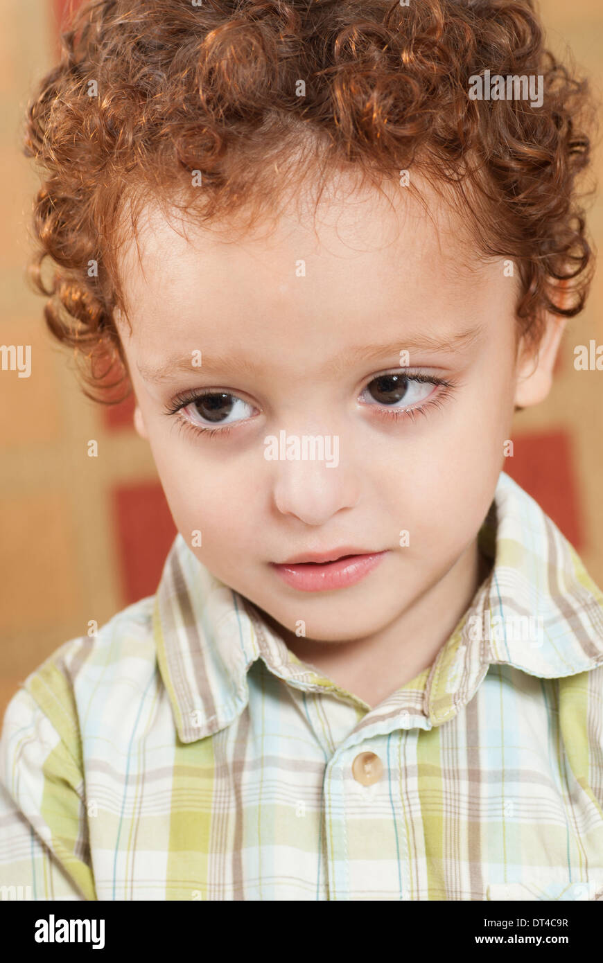 Serious little boy looking away Stock Photo - Alamy