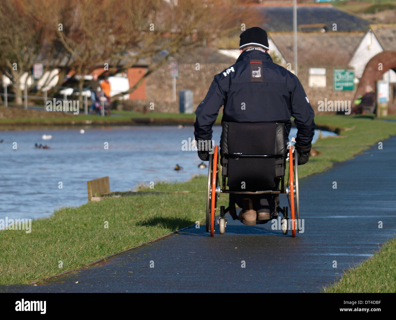 Man in a wheelchair along the canal, Bude, Cornwall, UK Stock Photo - Alamy