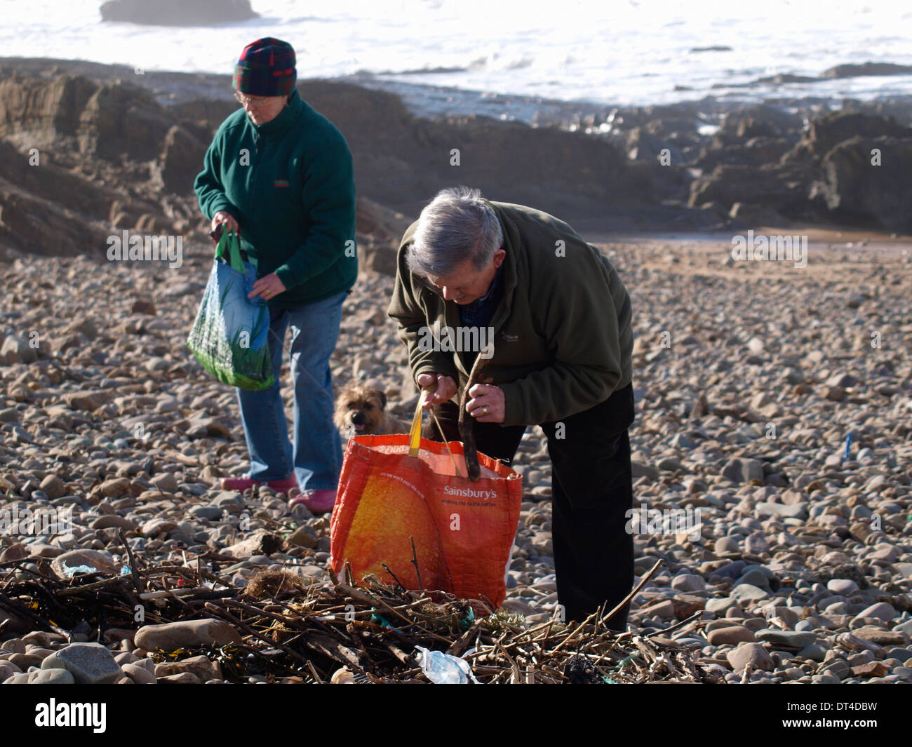 Couple collecting wood beach hi-res stock photography and images - Alamy