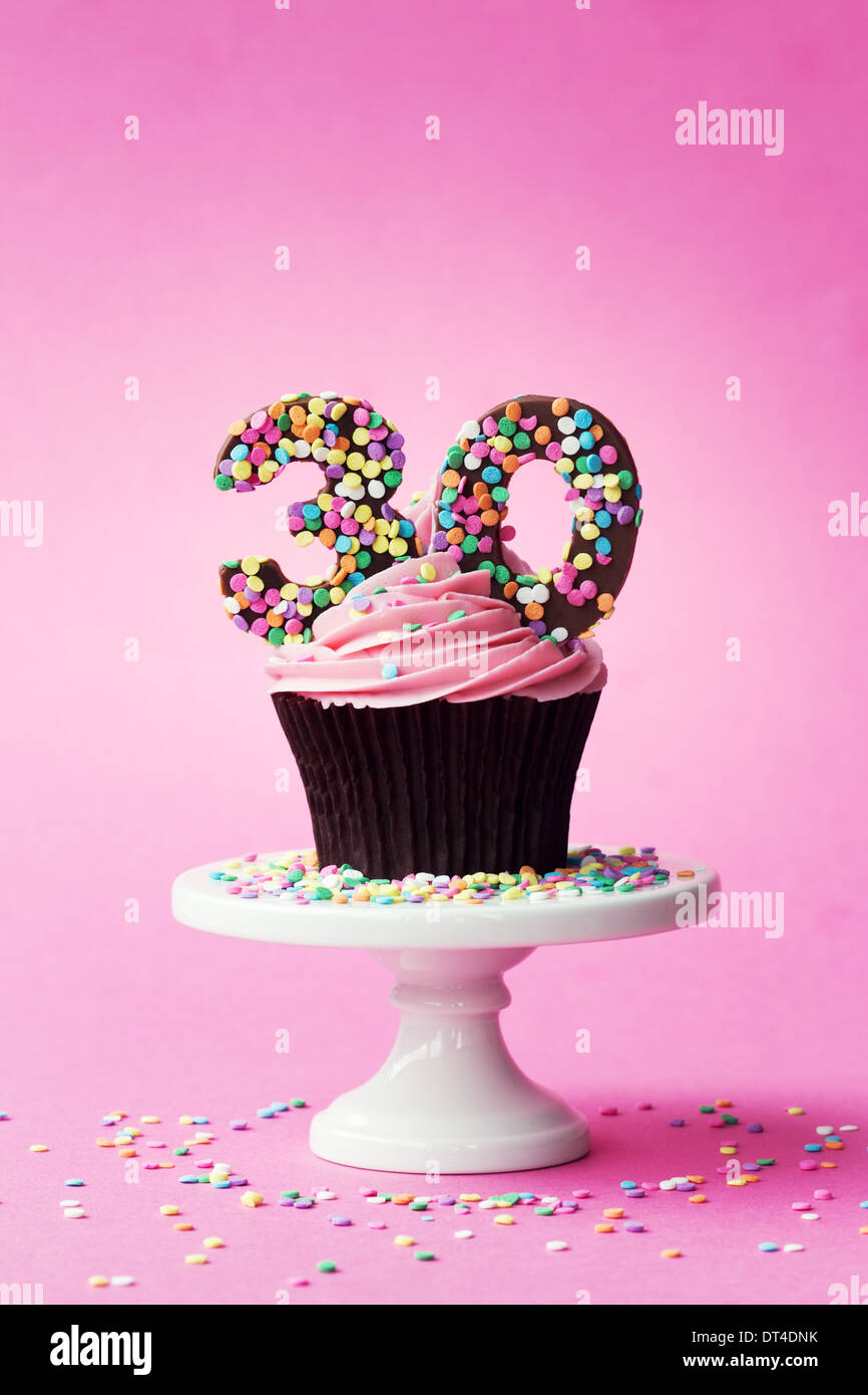 Cupcake decorated with chocolate numbers Stock Photo - Alamy
