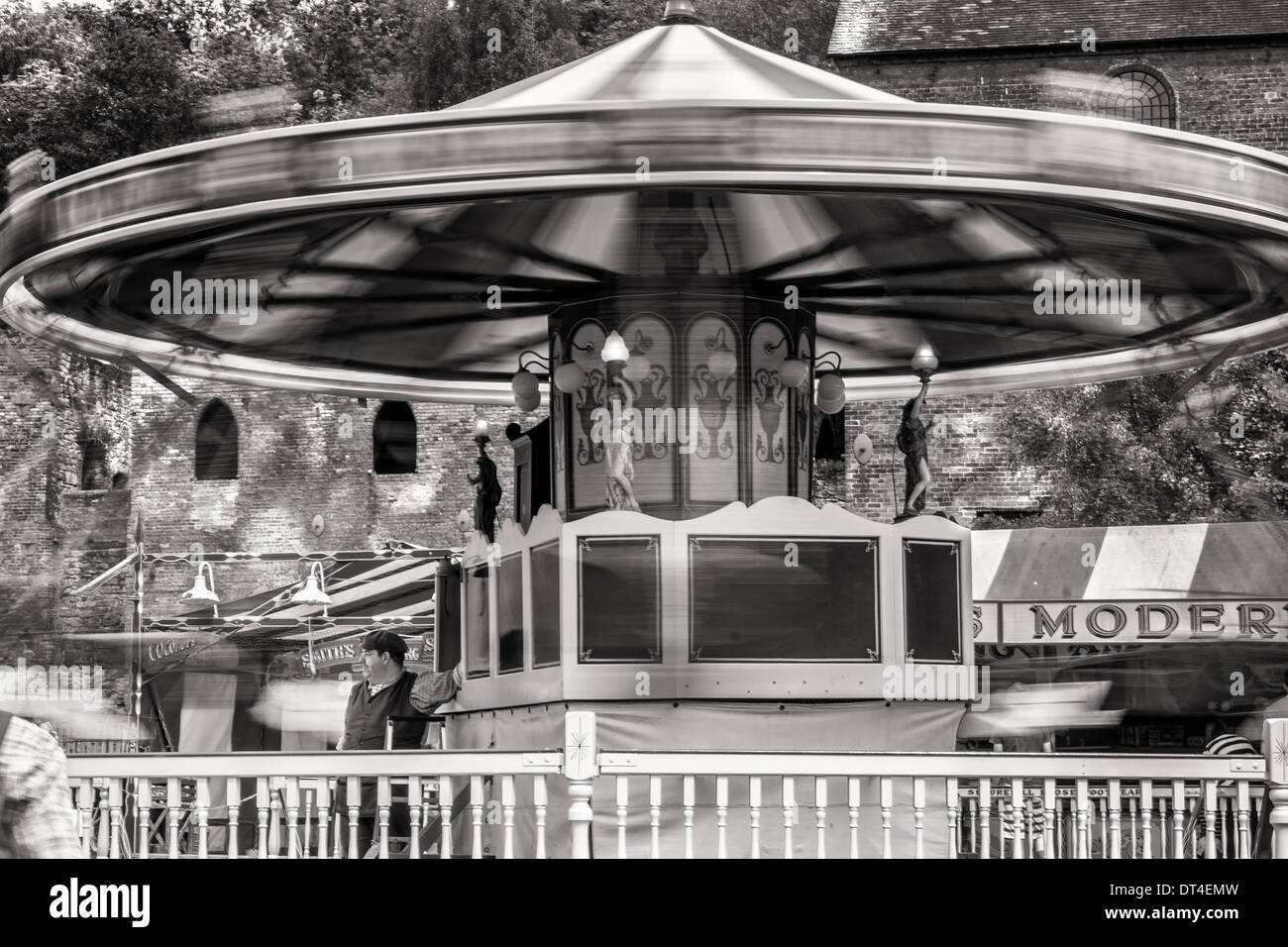 Yong Man operating Carousal fair ride at Blists Hill Victorian Town ...