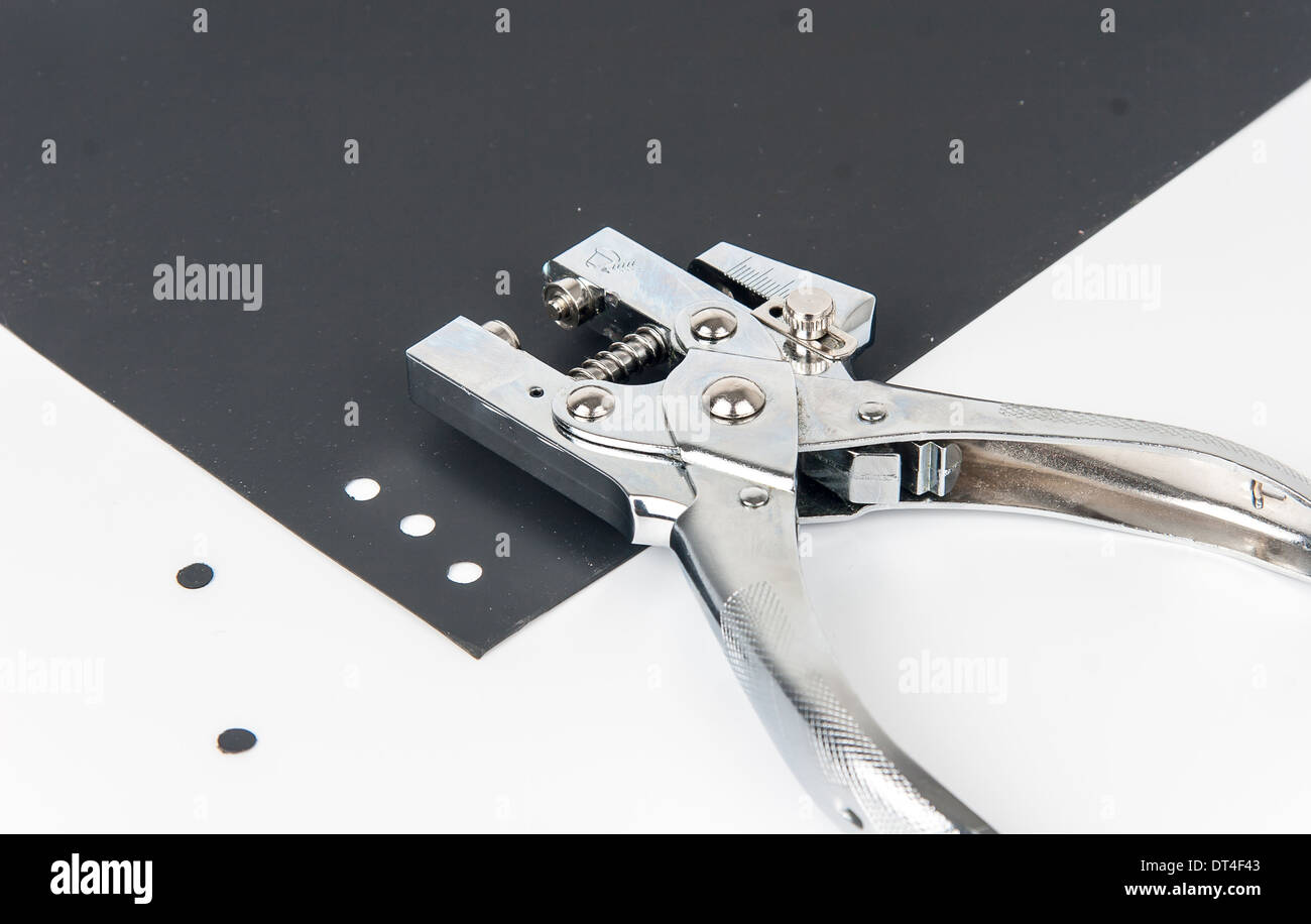 Office Puncher Unit isolated on white background Stock Photo - Alamy