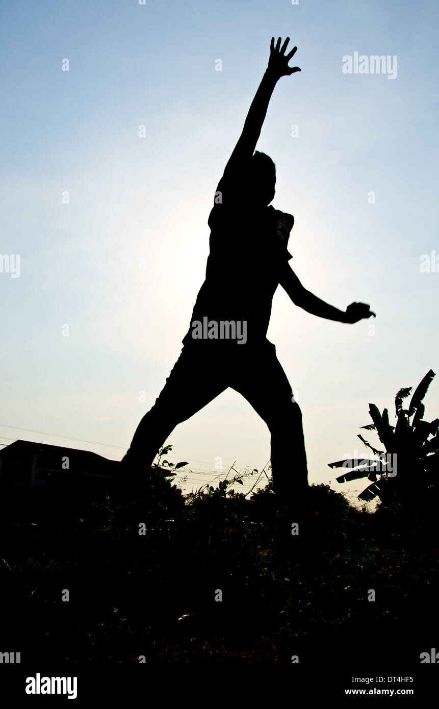 silhouette of man jumping for happy and victory Stock Photo - Alamy