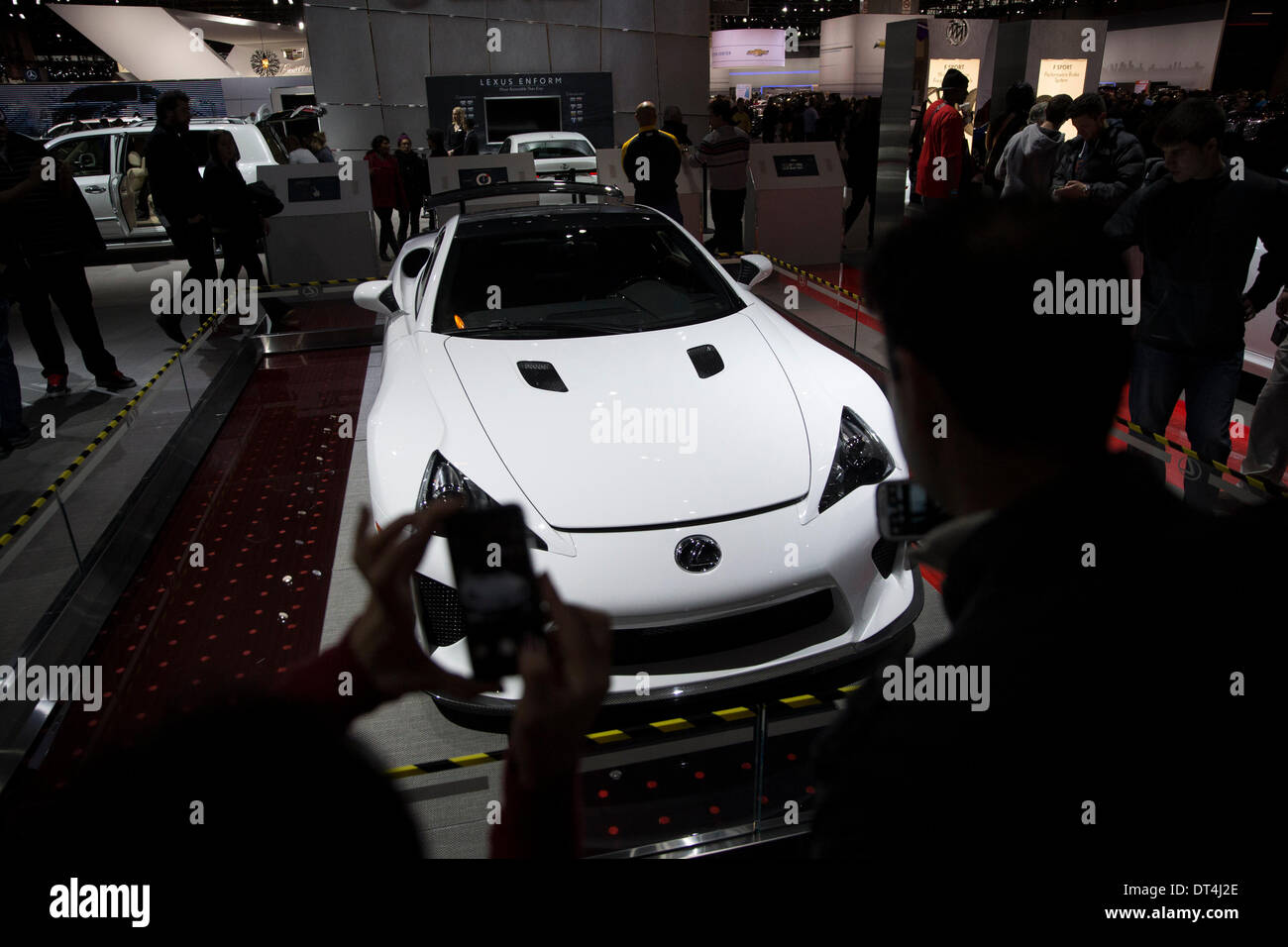 Chicago, USA. 8th Feb, 2014. Visitors take photos of the Lexus LFA ...