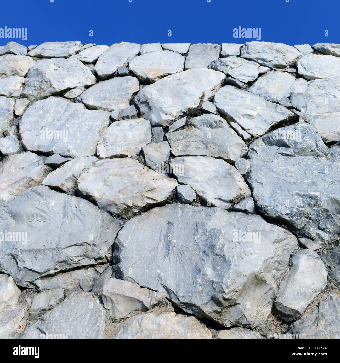 Stone wall background and texture with blue sky Stock Photo - Alamy