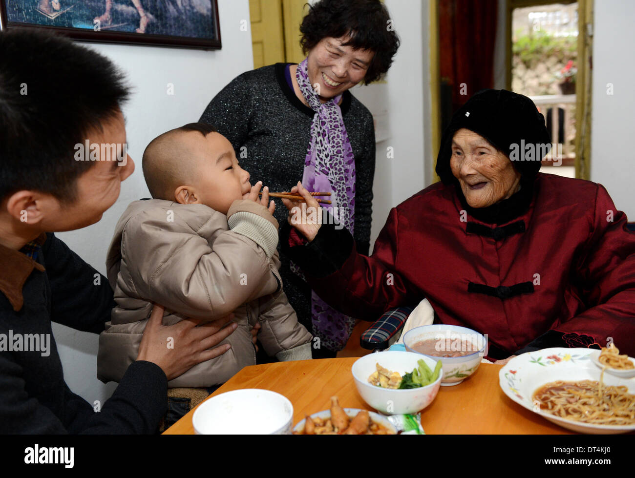 Fuzhou, China's Fujian Province. 4th Feb, 2014. Chen Wenyao's mother A Mei (R) feeds her great ...