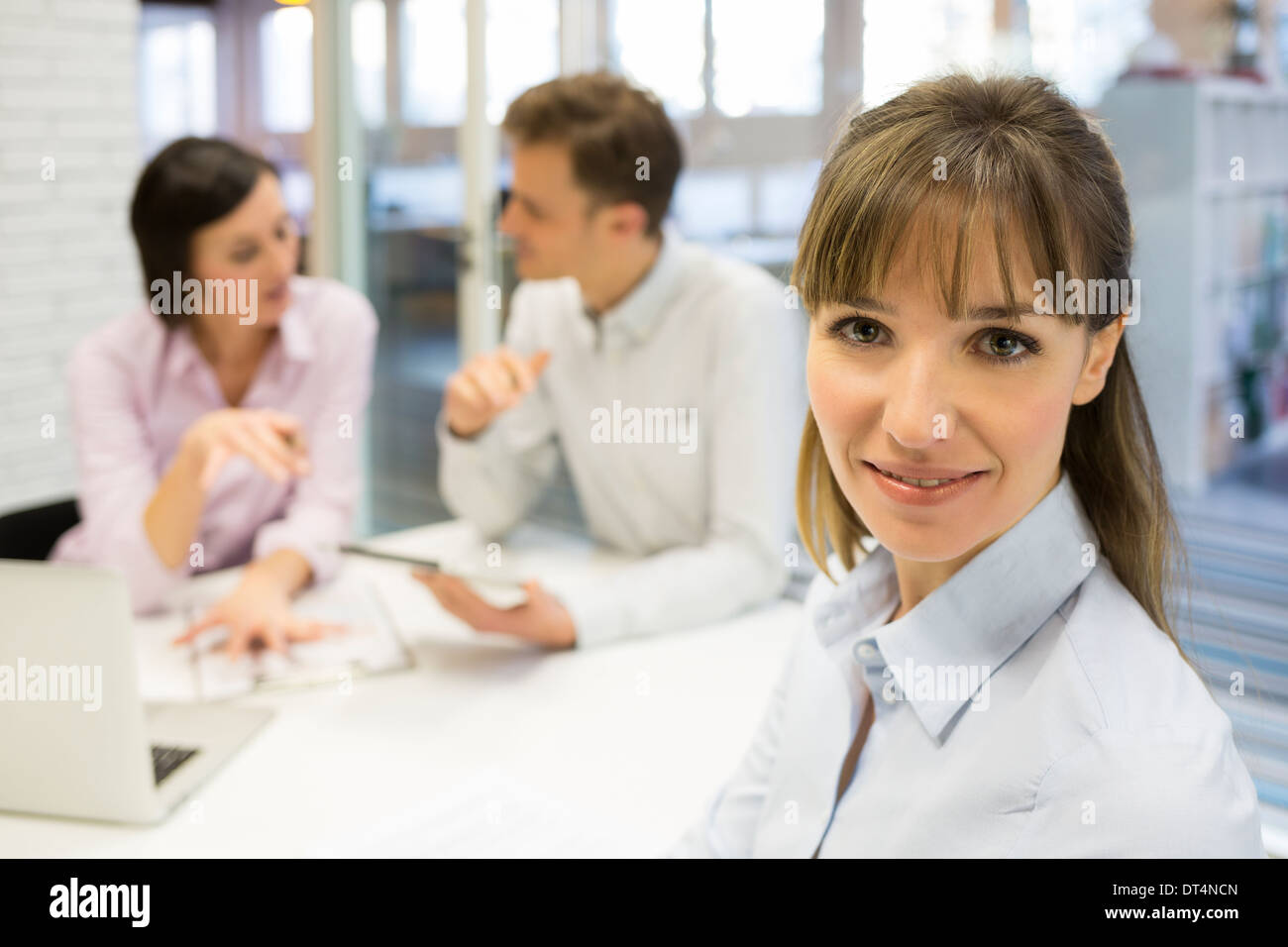 Business woman and male colleagues hi-res stock photography and images ...