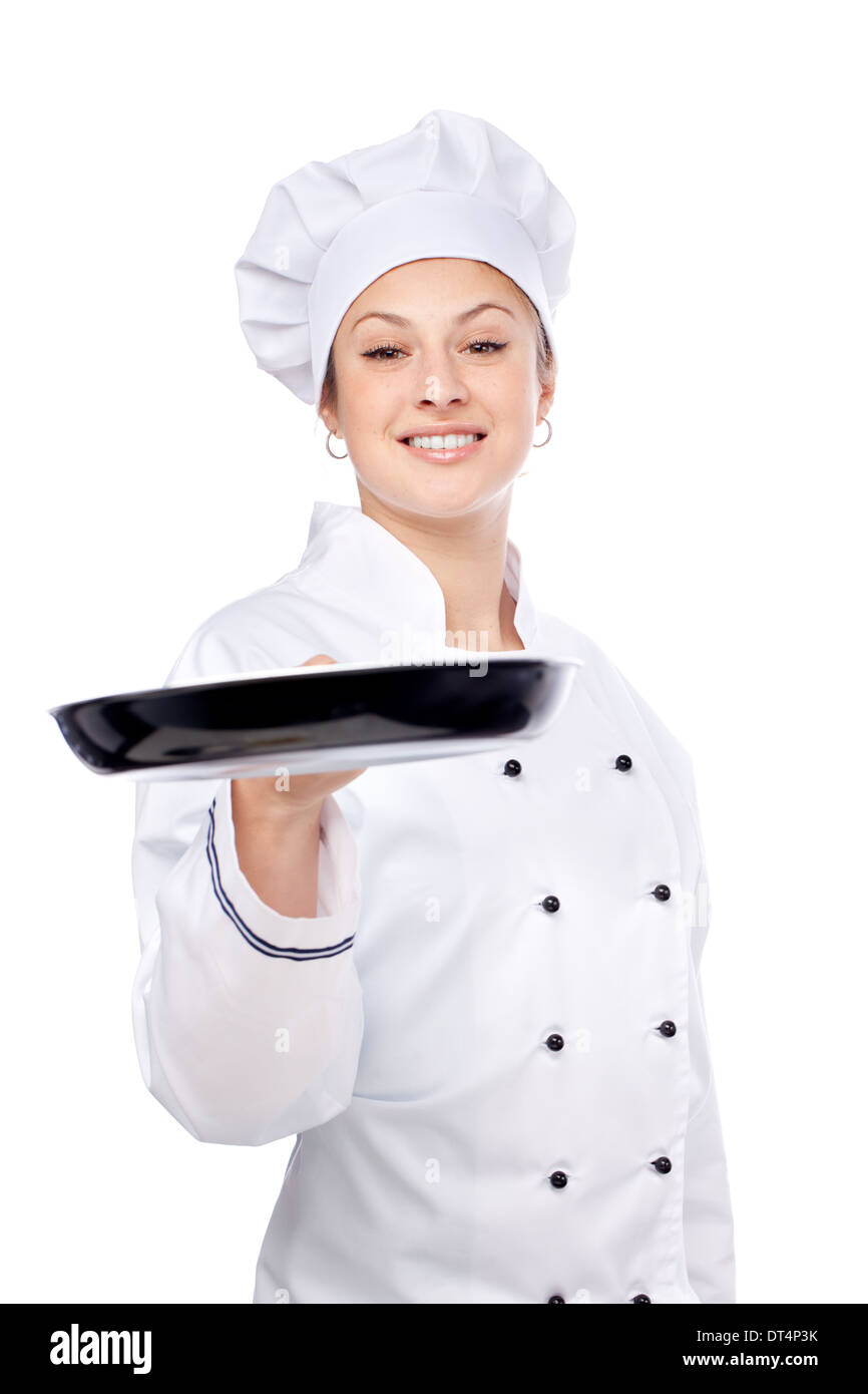 portrait of friendly chef woman holding pan on white background Stock ...