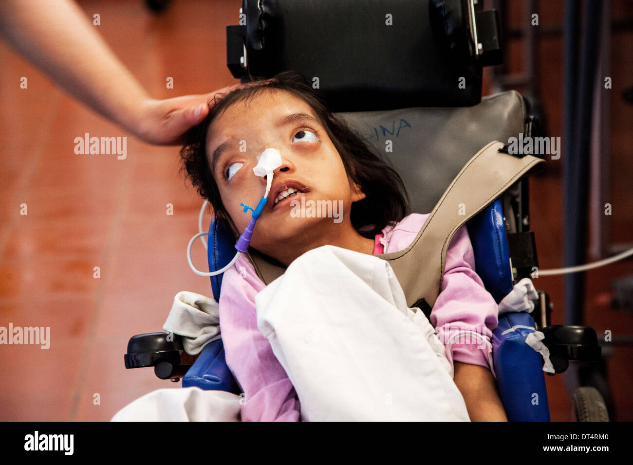 Carers hand on girls head hi-res stock photography and images - Alamy