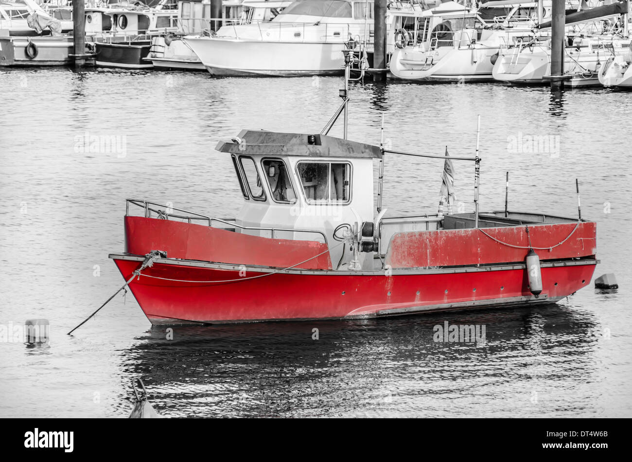 Red fishing boat on black and white background Stock Photo - Alamy