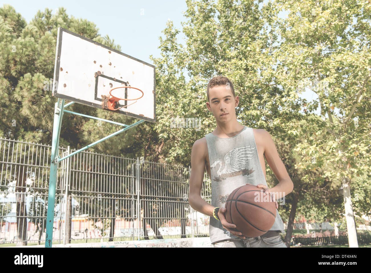 Young man playing basketball outdoor Stock Photo - Alamy