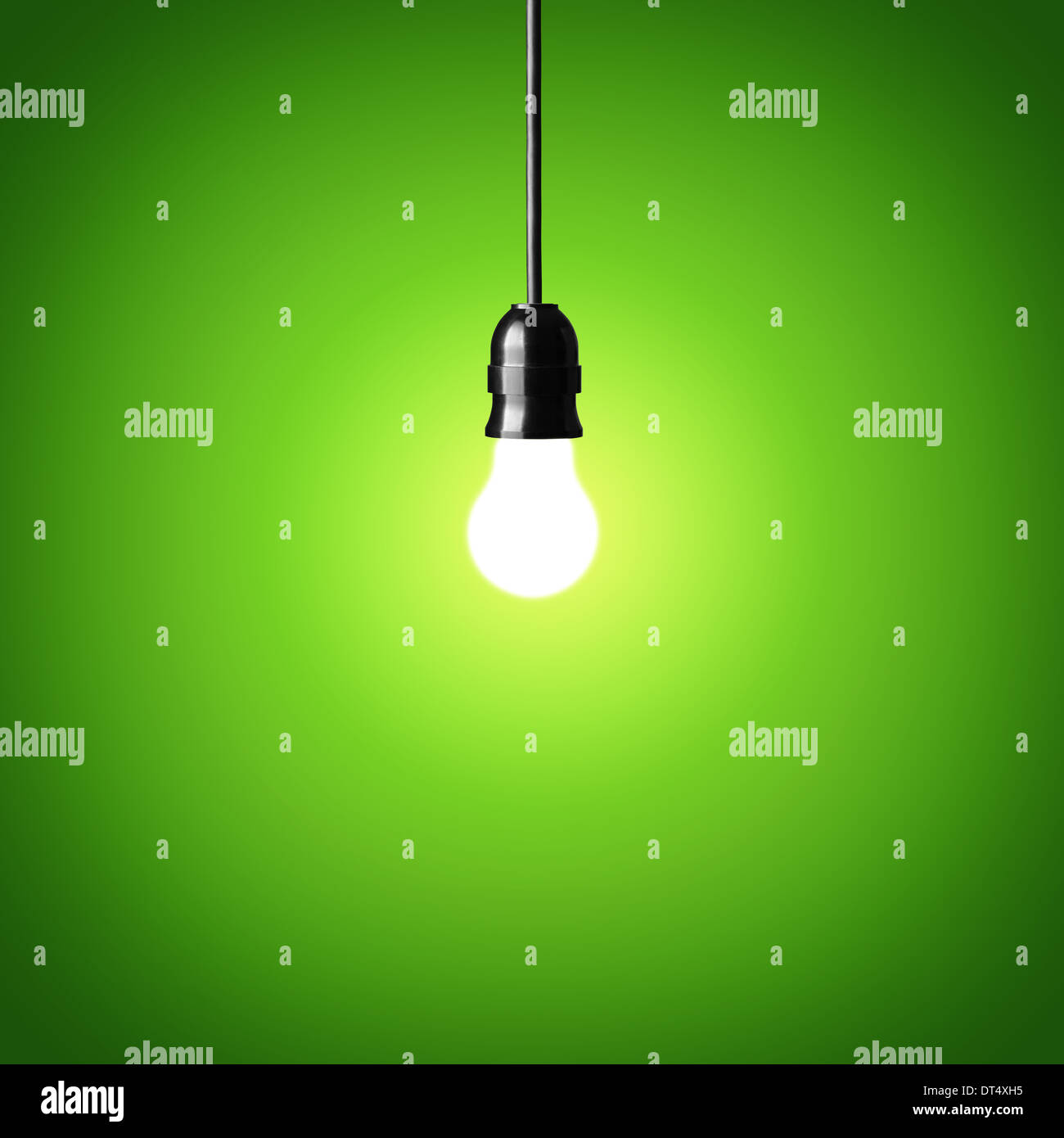 Bulb on green background.Idea concept Stock Photo - Alamy