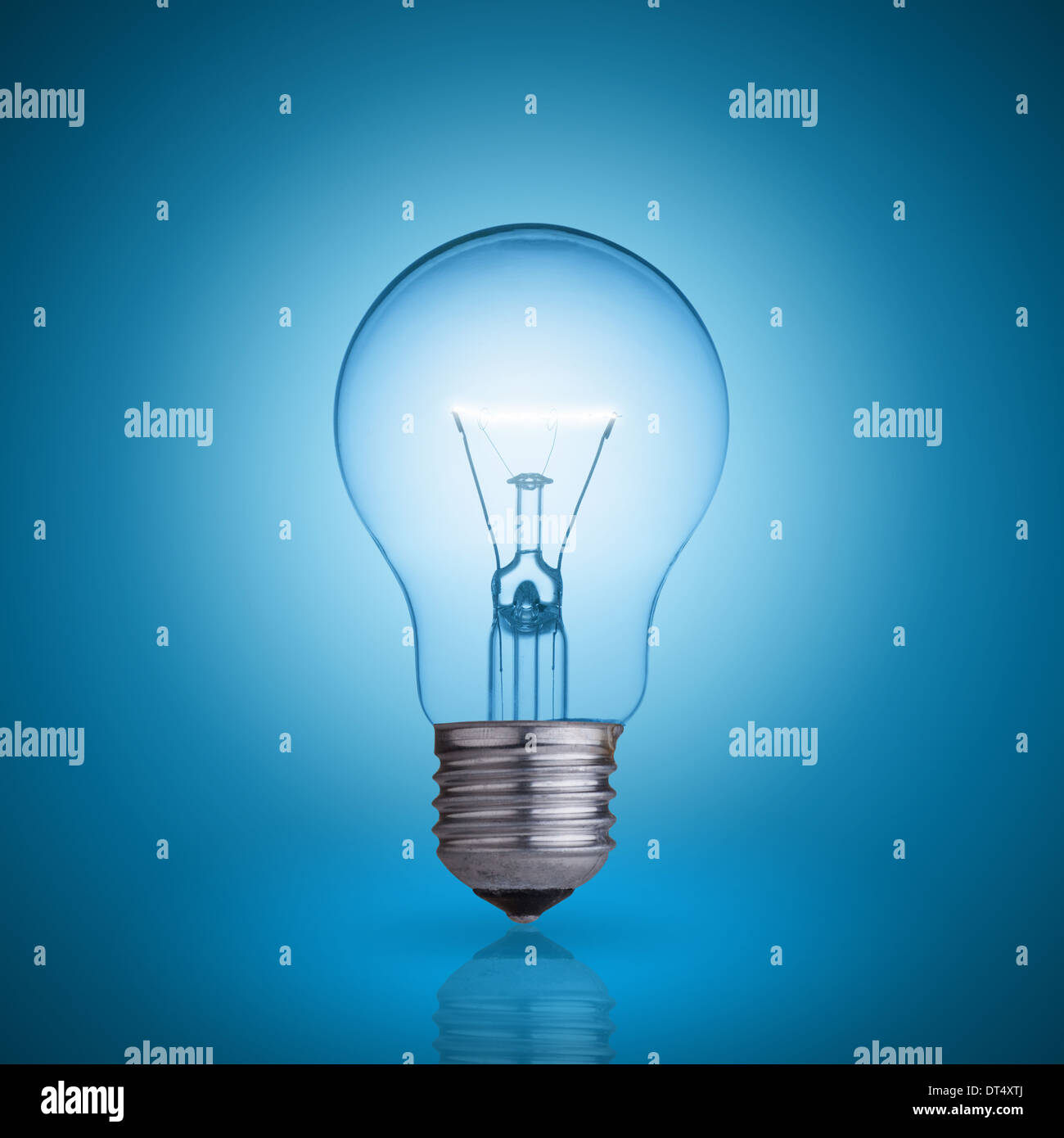 light bulb on blue background Stock Photo - Alamy