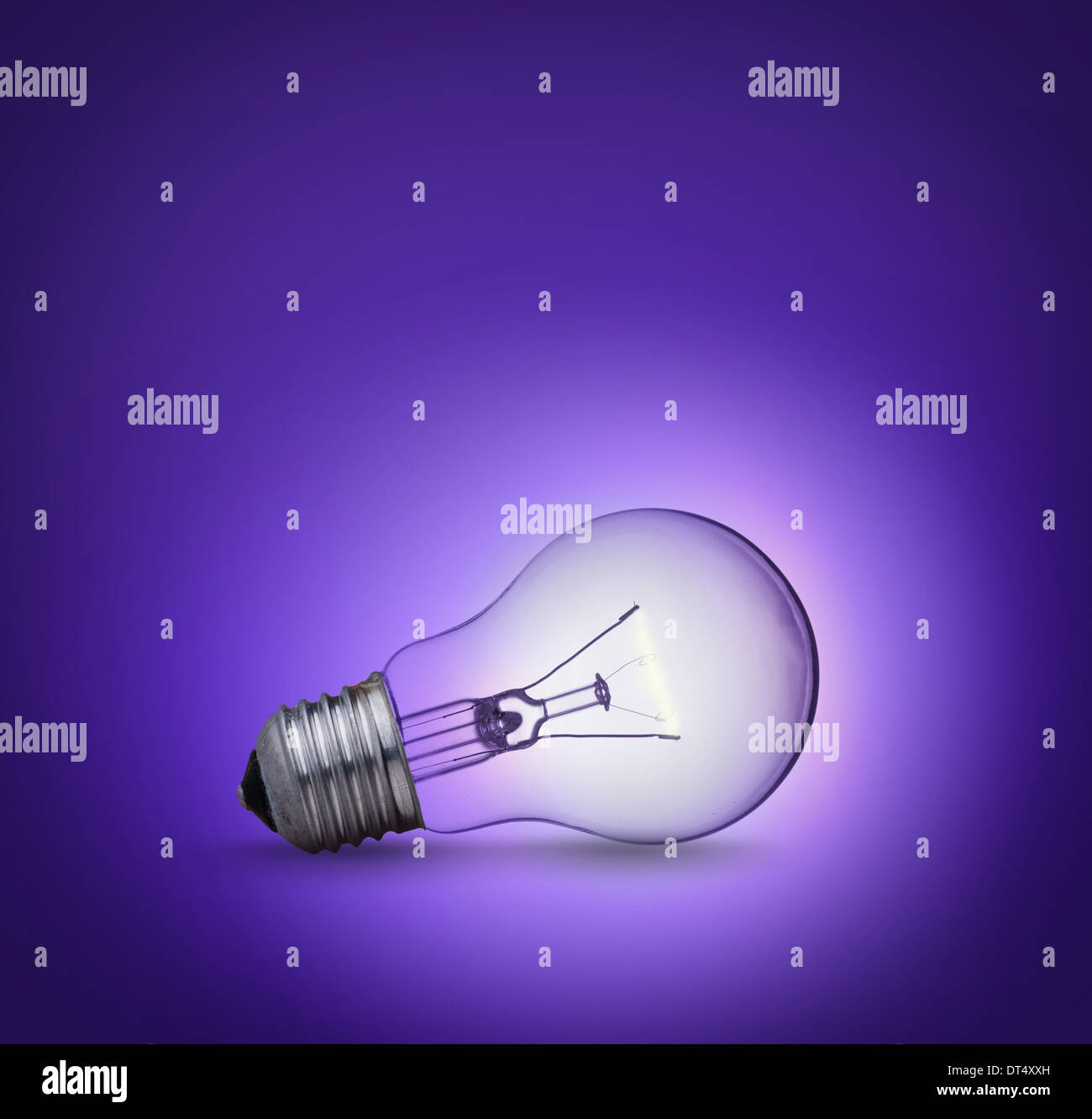 light bulb on purple background Stock Photo - Alamy