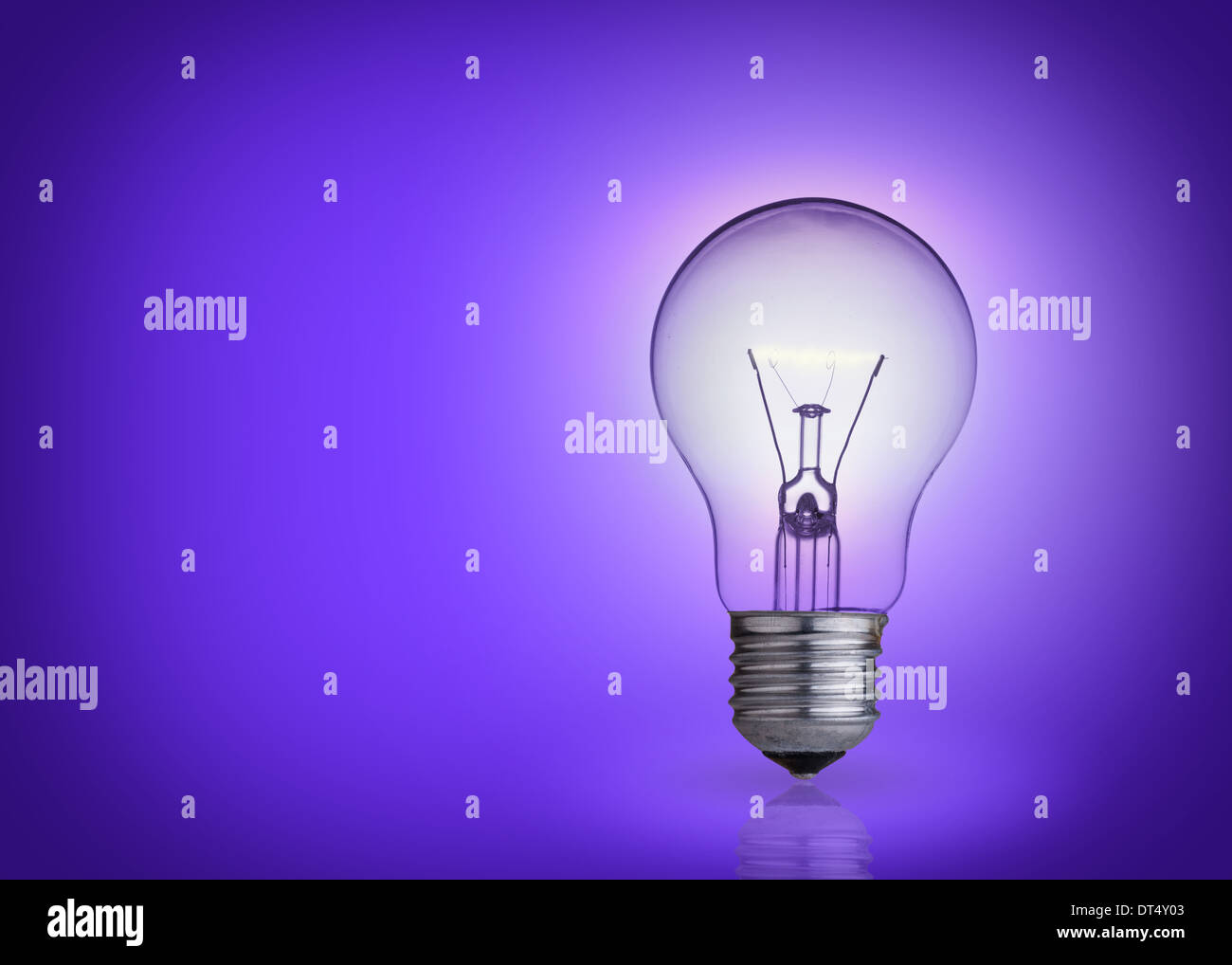 light bulb on purple background Stock Photo - Alamy