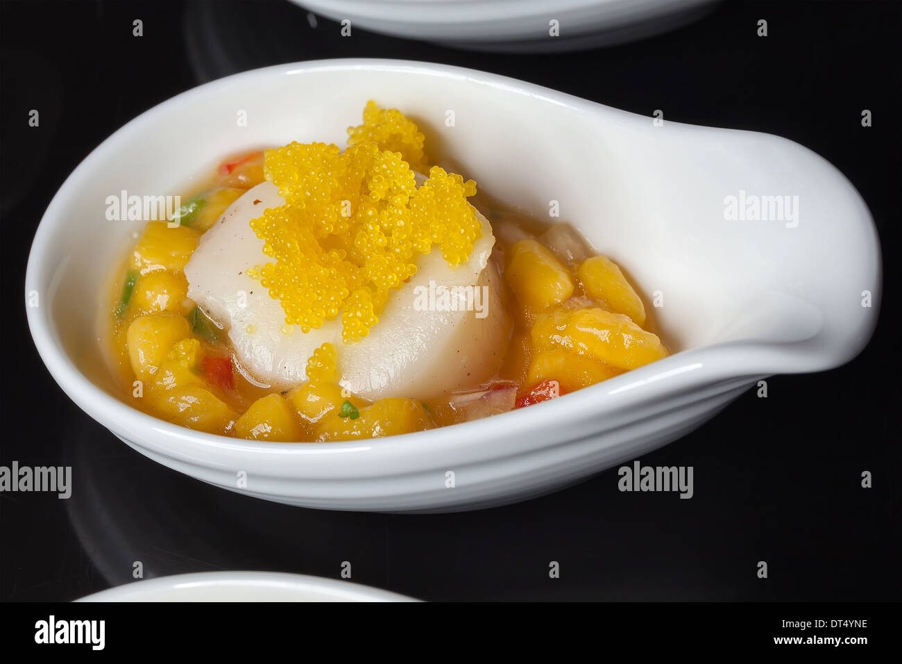 Scallop with mango sauce appetizer Stock Photo - Alamy