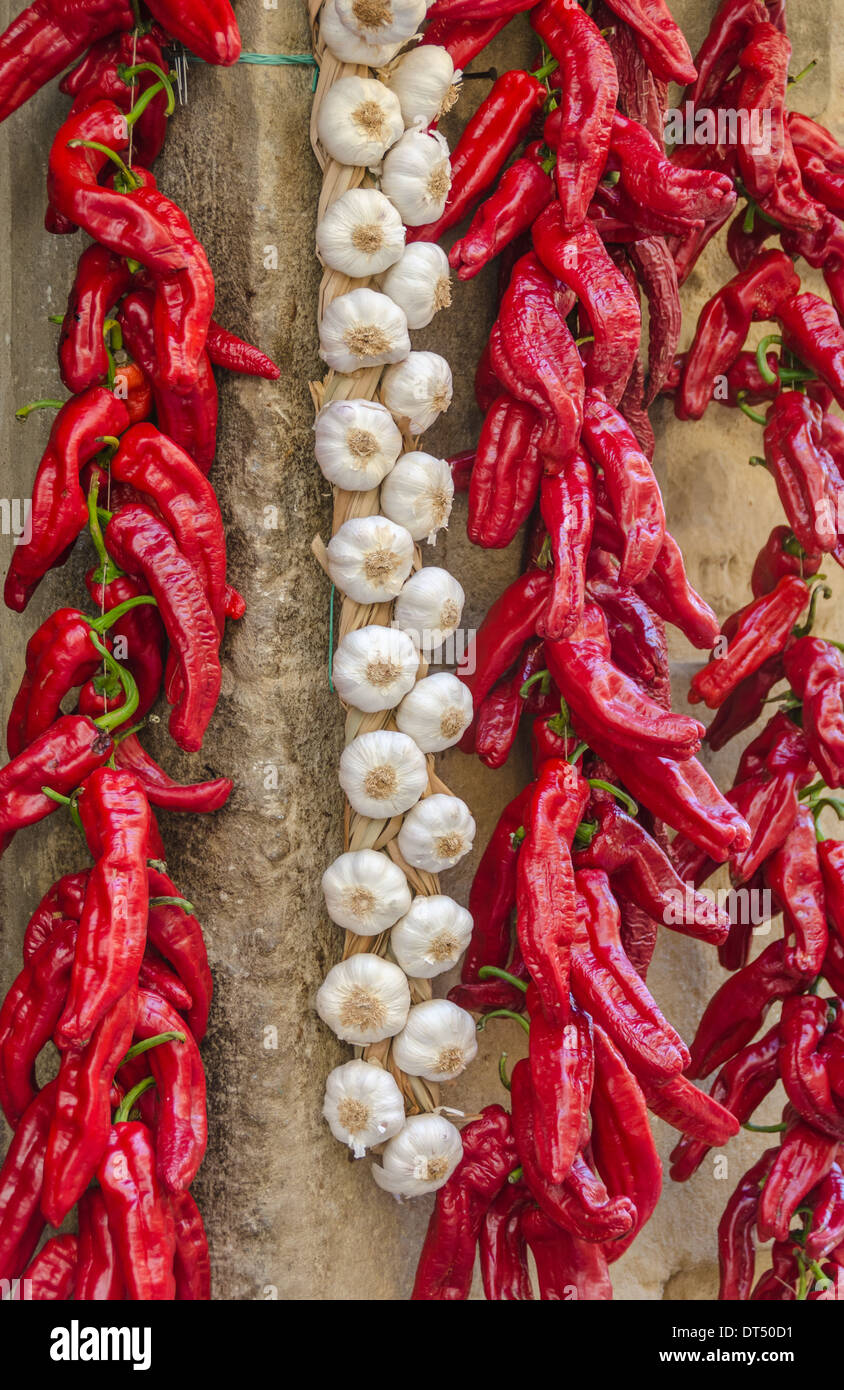 Typical string of red peppers and garlic in Spain Stock Photo - Alamy